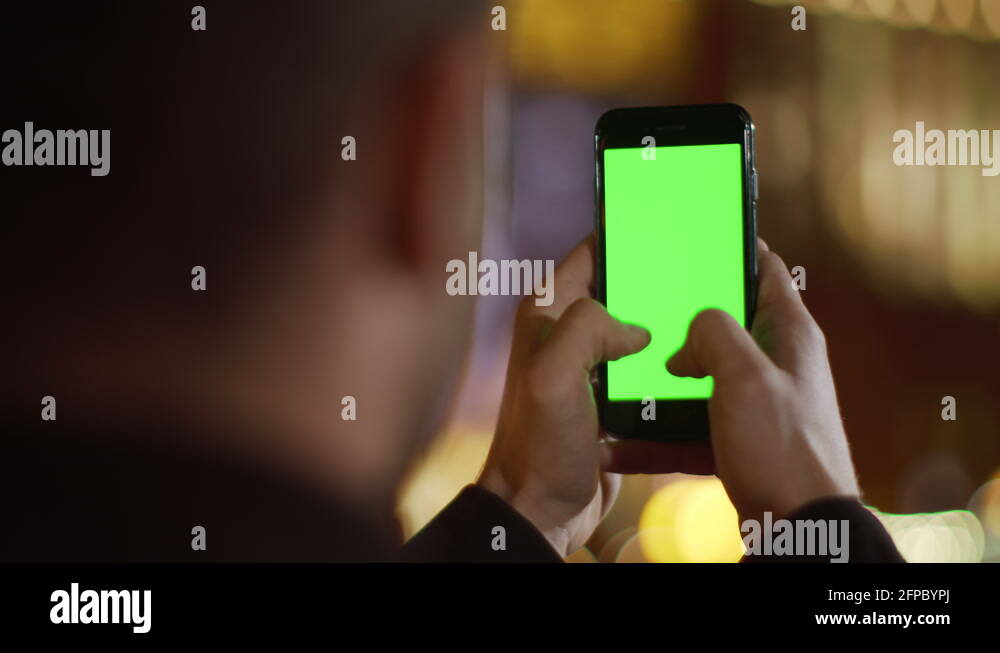 Man hands messaging phone green screen. Unrecognizable guy using mock ...