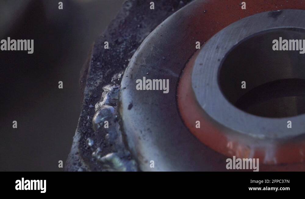 Hitting Welded Part Of A Circular Metal With A Flat Head Hammer After ...