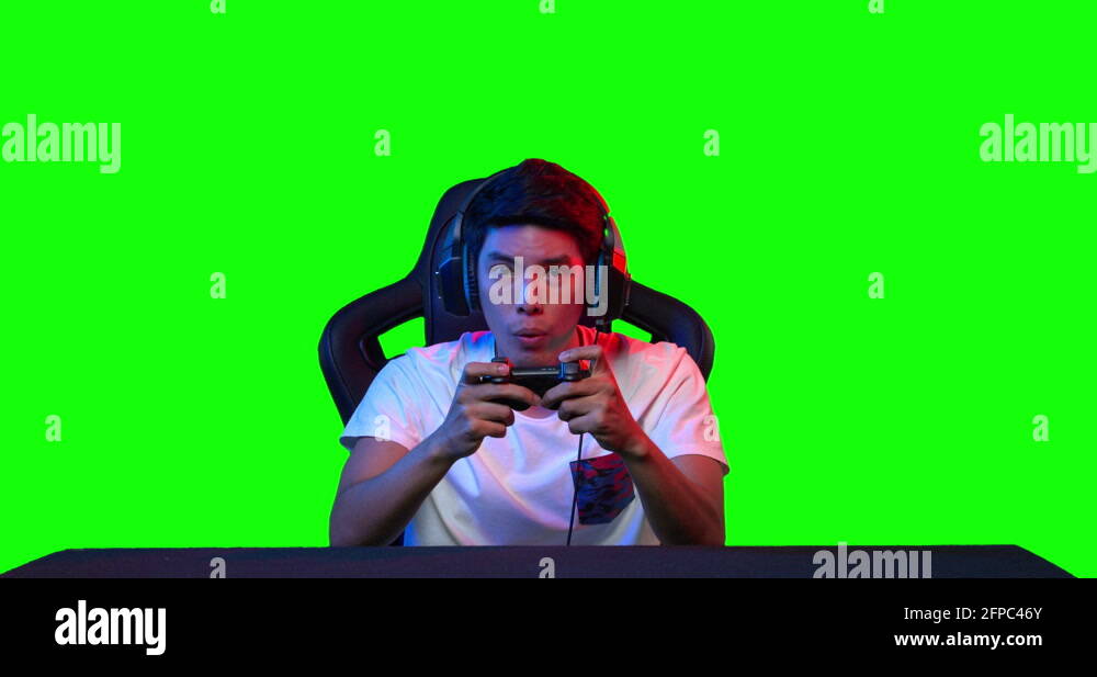 Pro esport gamer playing in online video game over green screen ...