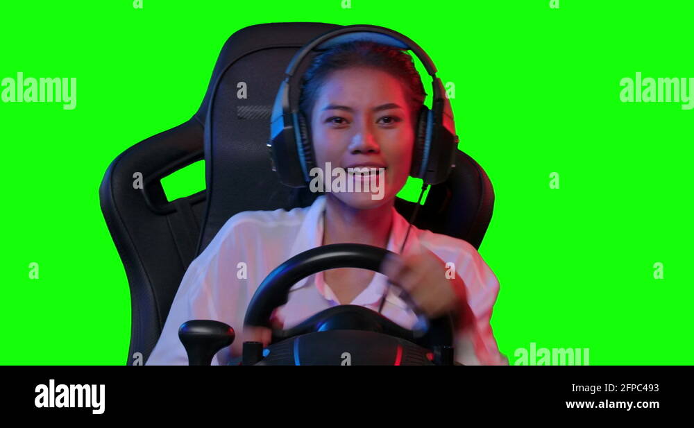 Pro gamer playing in car racing game over green screen background Stock ...