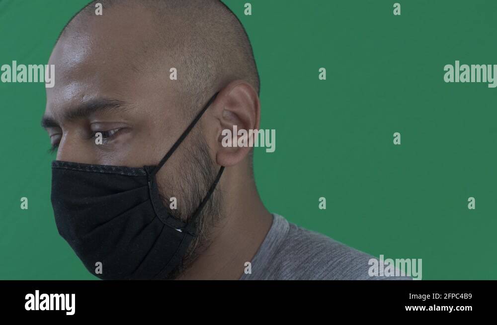 Adult Male Wearing Face Mask Looking Off Screen. Left Side Face View ...