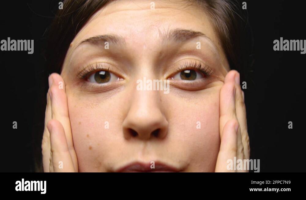 Woman stares into mirror upset with her aging reflection Stock Video ...