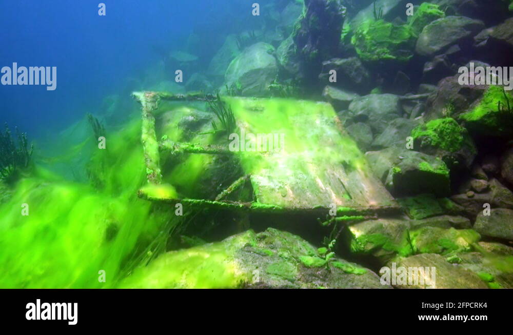 Underwater landscape of clear transparent ice under cold water of lake ...