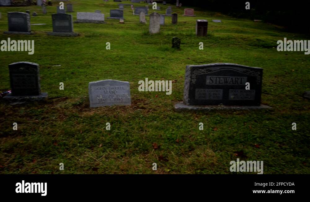 graveyard dusk scene on a hill with green grass Stock Video Footage - Alamy