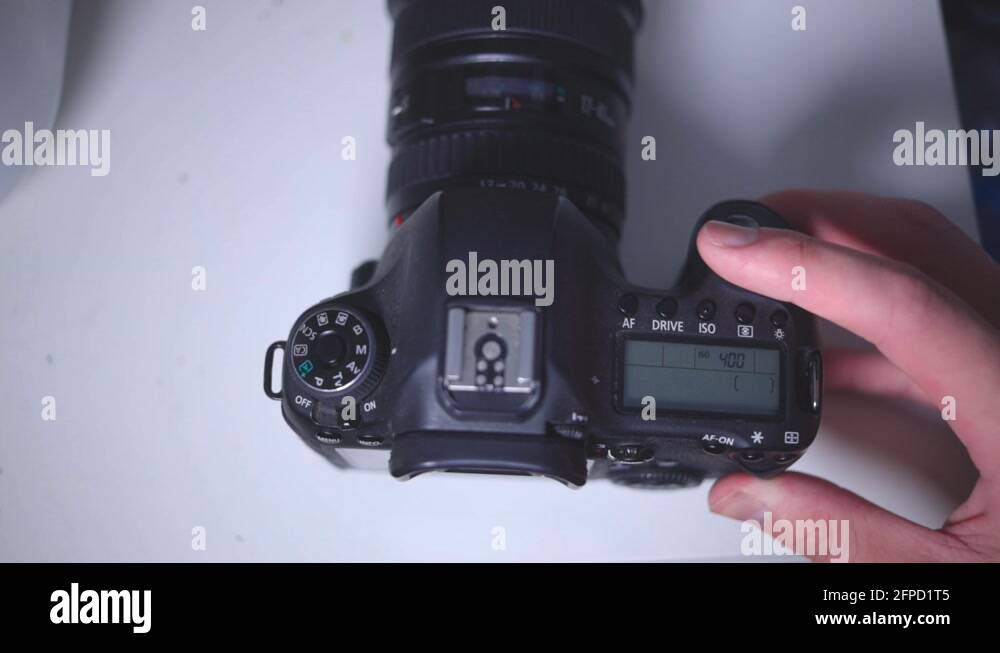 Person Adjusting The ISO Setting Button Of A Modern Camera. - Close Up ...
