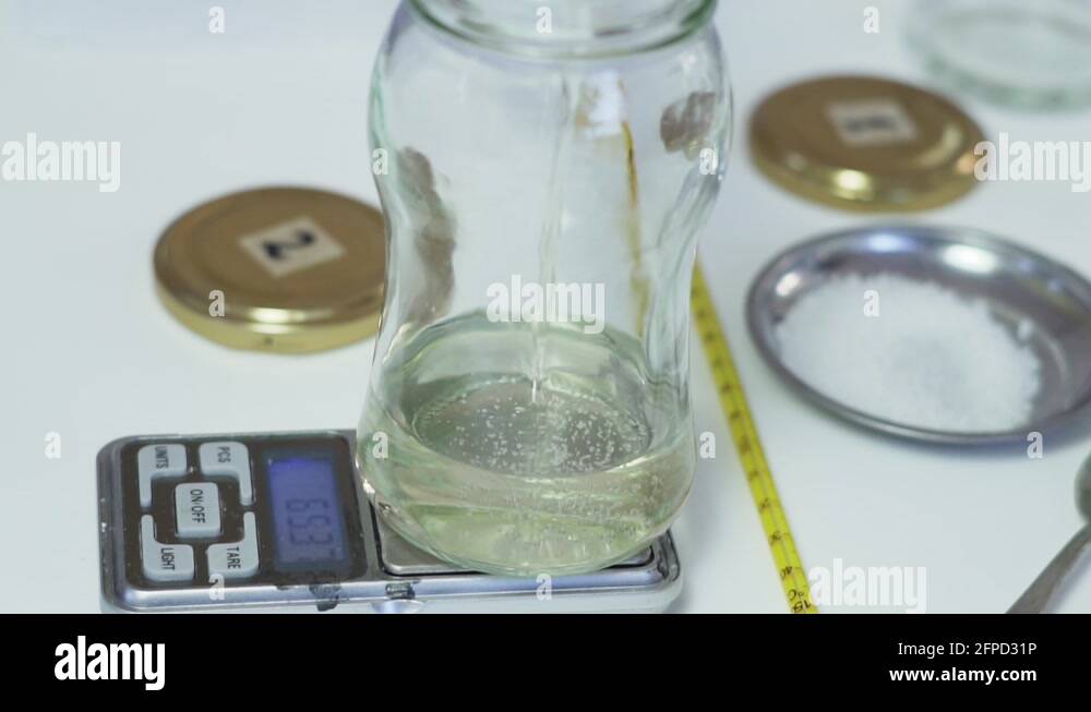 Measuring medicinal syrup for dosage - Close up Slow motion Stock Video ...