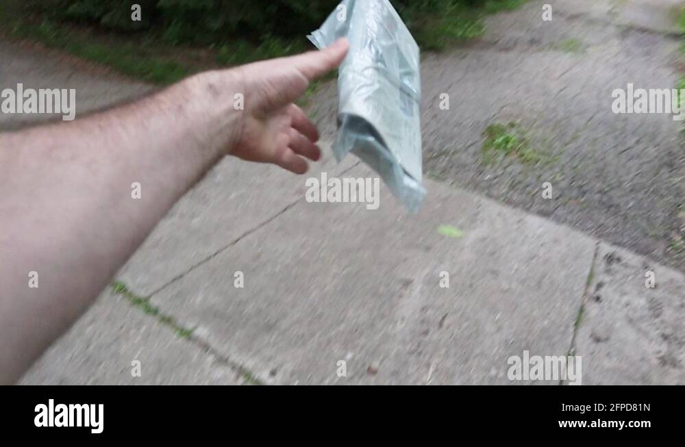 Throwing a newspaper Stock Videos & Footage - HD and 4K Video Clips - Alamy