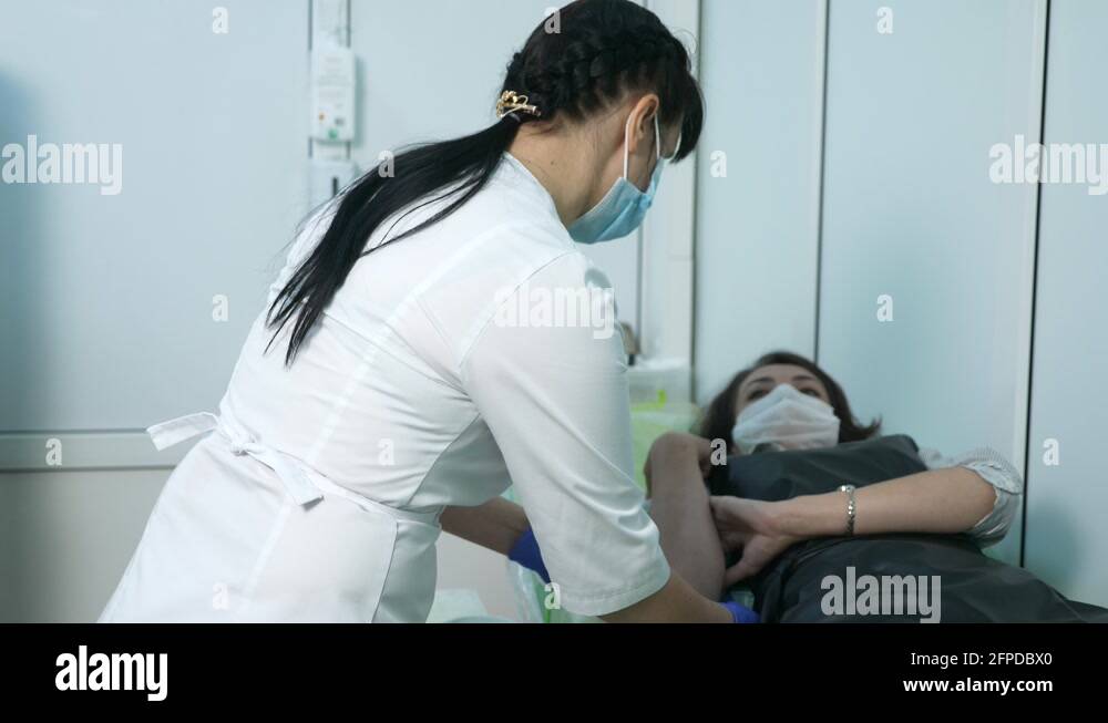 Nurse Drawing Blood Sample From Vein for Test for Female Patient. Slow ...