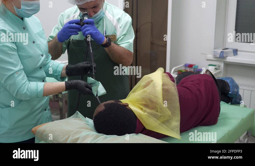 Doctor Performing Endoscopy with Fiber Gastroscope Endoscope Patient in ...