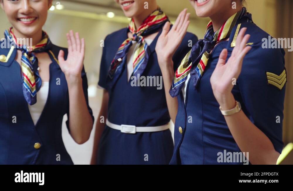 Cabin crew waving hand for greeting or goodbye Stock Video Footage - Alamy