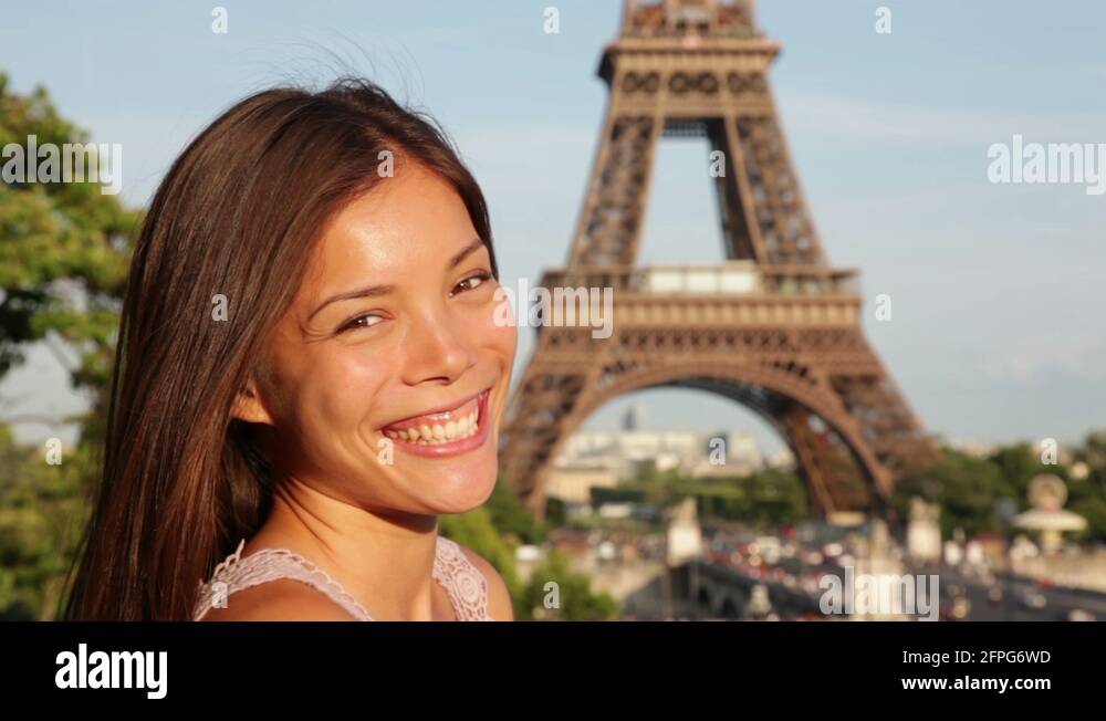 Woman smiling laughing at Eiffel Tower, Paris Stock Video Footage - Alamy