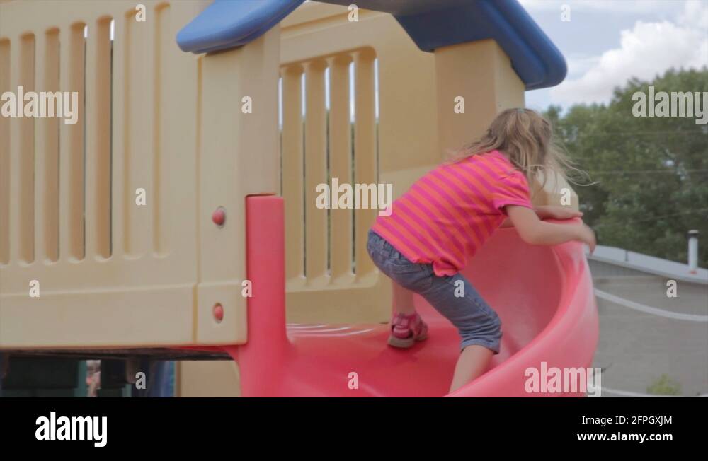 young kids playing on the playground Stock Video Footage - Alamy