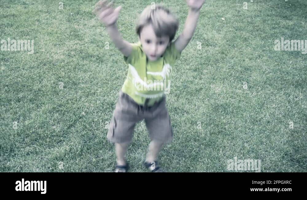 a young boy doing jumping jacks Stock Video Footage - Alamy