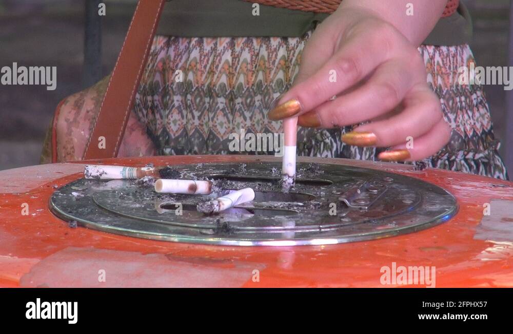 Cigarette stub hand Stock Videos & Footage - HD and 4K Video Clips - Alamy