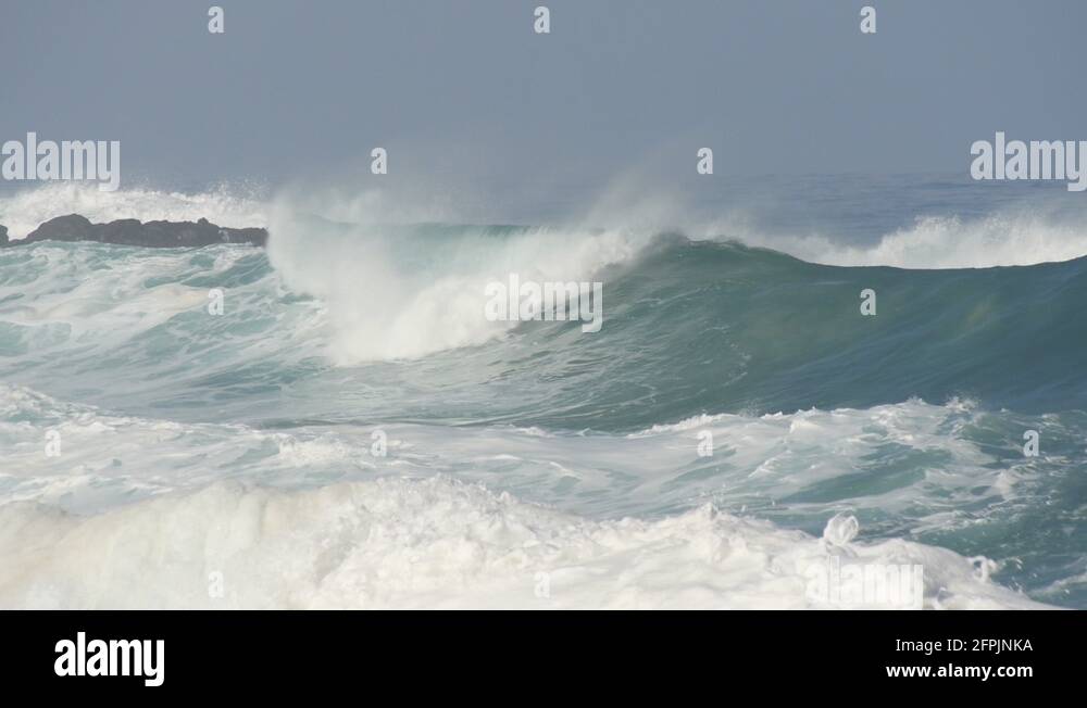 Ocean big wave crushing high tide stormy surge tsunami shore break ...