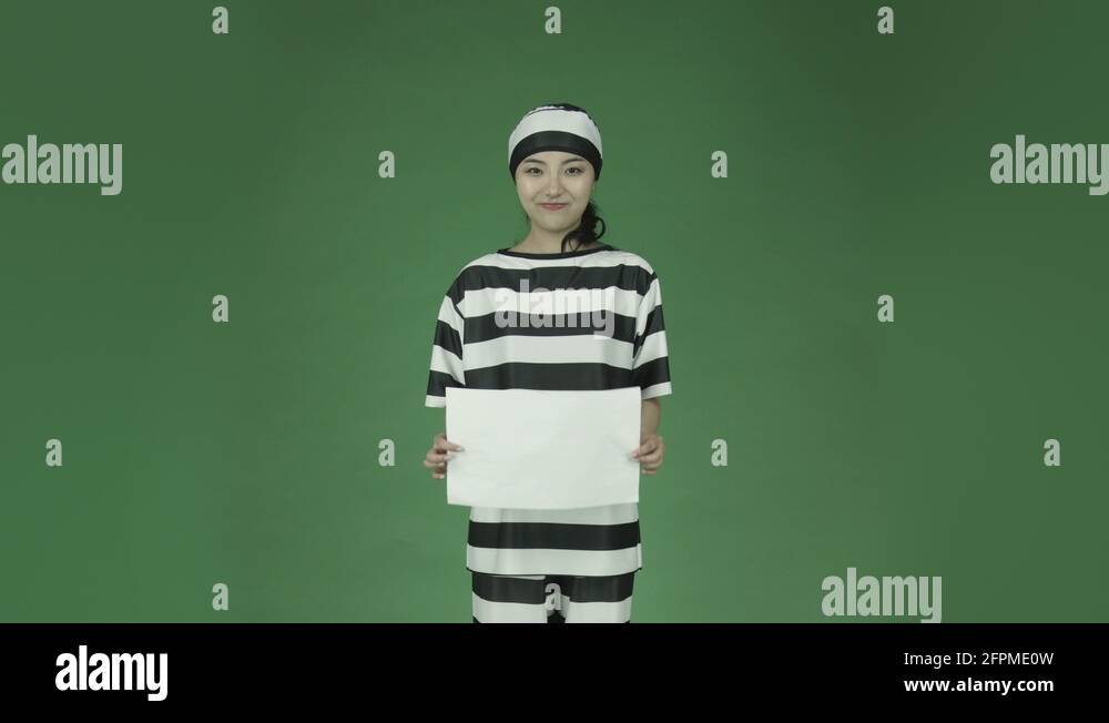young asian adult woman prisoner isolated on green-screen background ...
