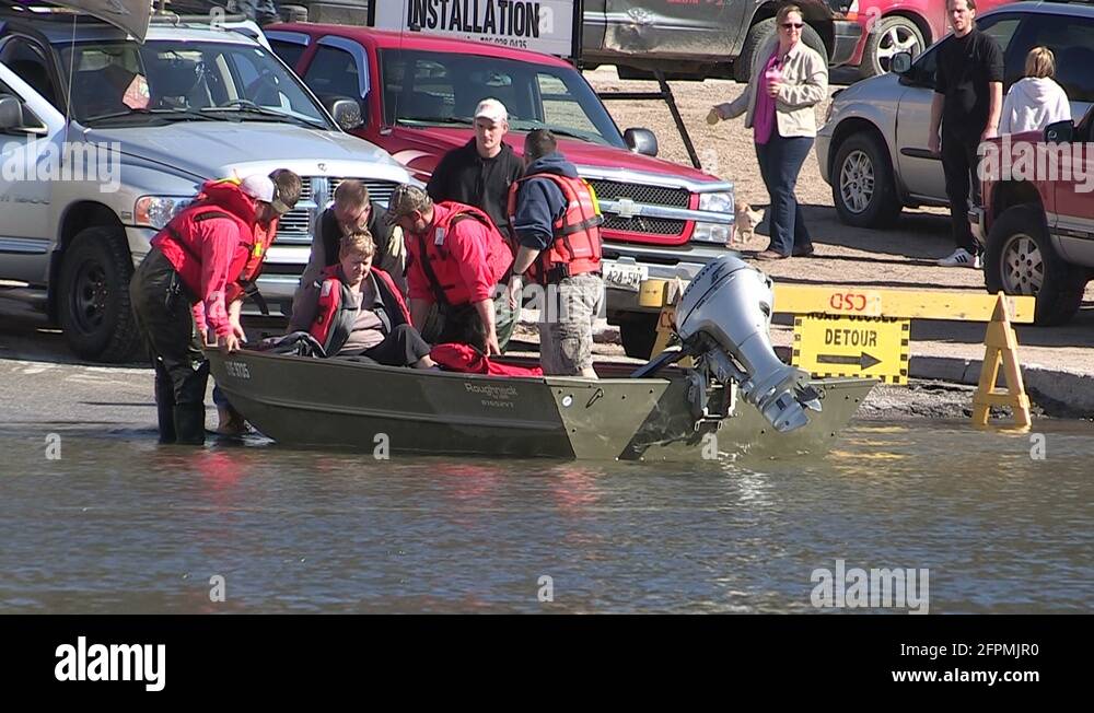 People rescued by fire department in spring flooding Stock Video ...