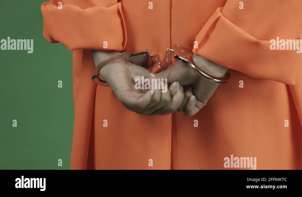 young asian adult woman prisoner isolated on green-screen background ...
