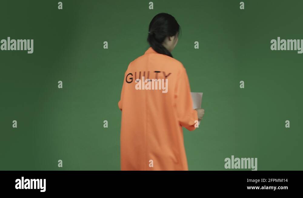 young asian adult woman prisoner isolated on green-screen background ...