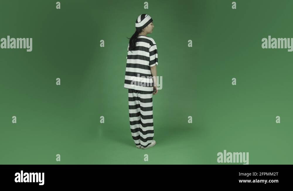 young asian adult woman prisoner isolated on green-screen background ...