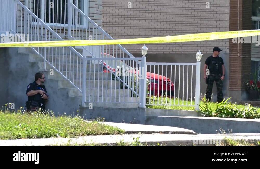 Two police officers standing by during high risk standoff Stock Video ...