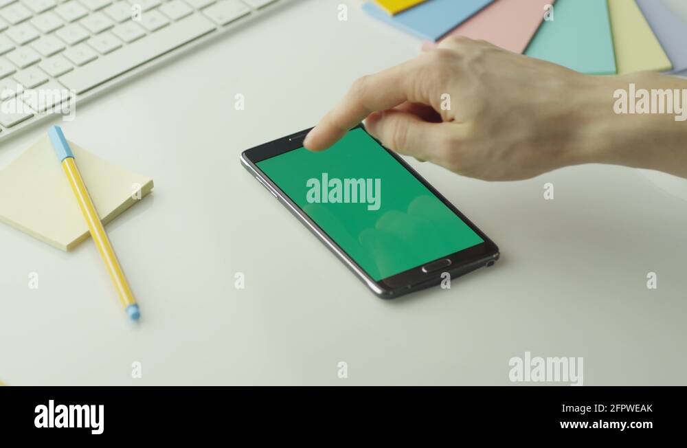Designer is Using Android Phone with Green Screen in Portrait Mode ...
