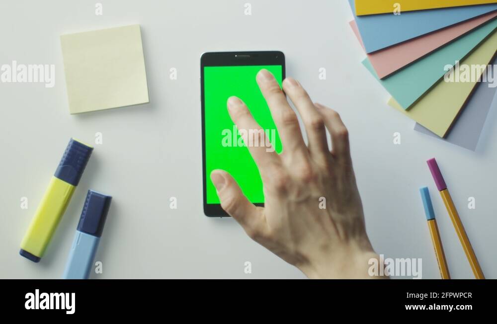 Designer is Using Android Phone with Green Screen in Portrait Mode. Top ...