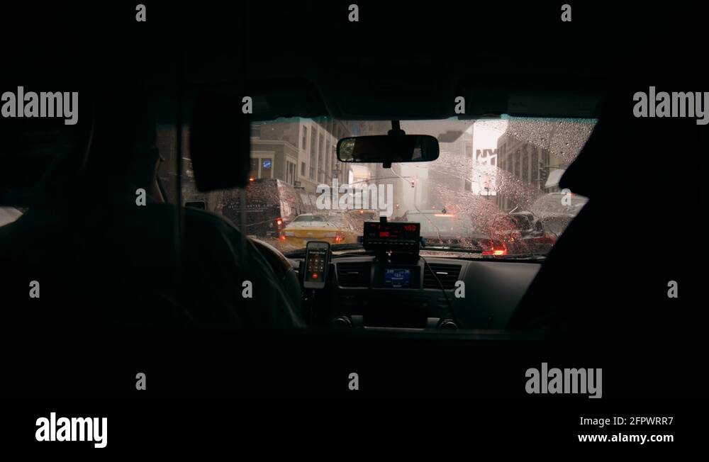 taxi driver inside interior cab rear view mirror meter raining ...