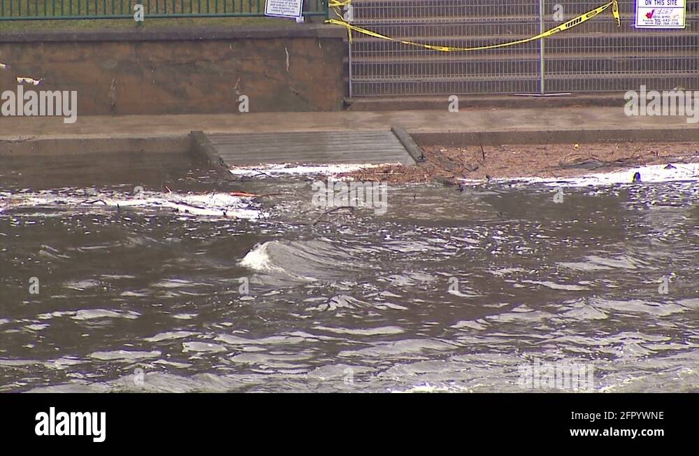 Water rushing fast and furious over hydroelectric power dam after storm ...