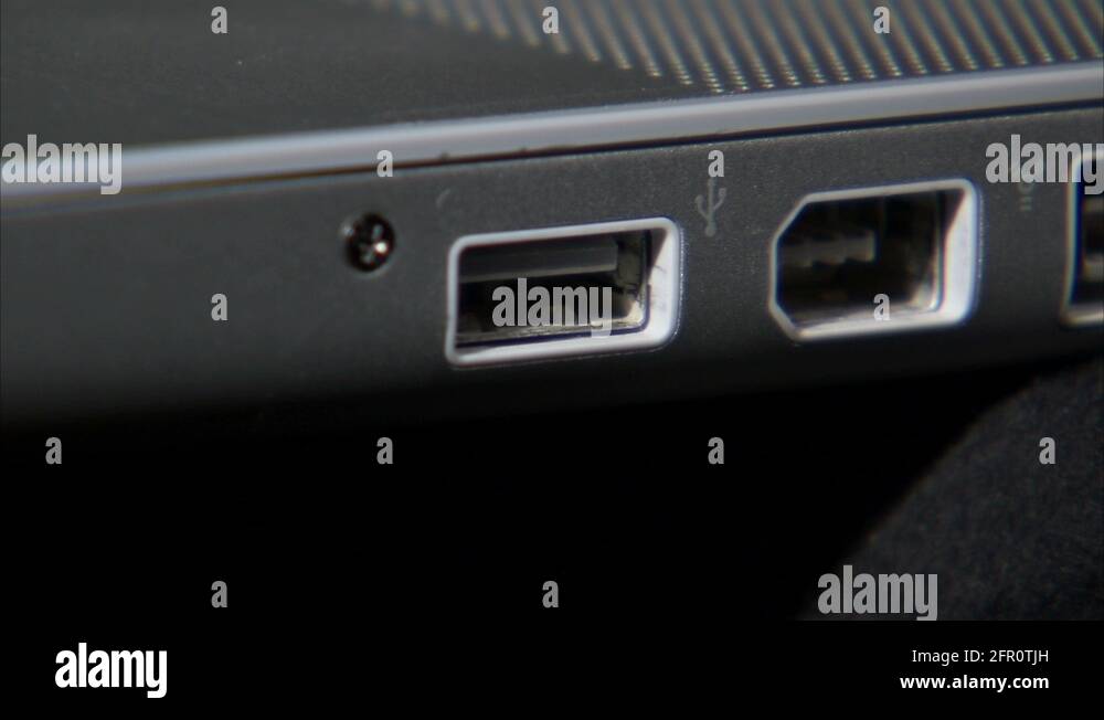 Close up of a USB drive plugging into a laptop Stock Video Footage - Alamy