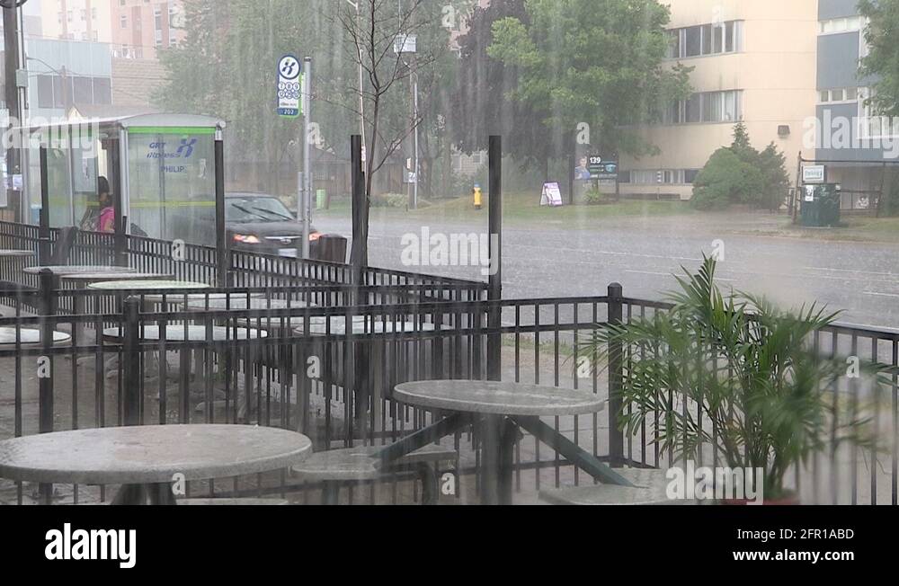 Torrential deluge of rain in severe thunderstorm with small hail Stock ...