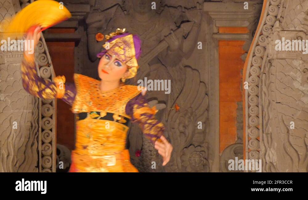 female balinese dancer in traditional costume dancing on stage Stock ...