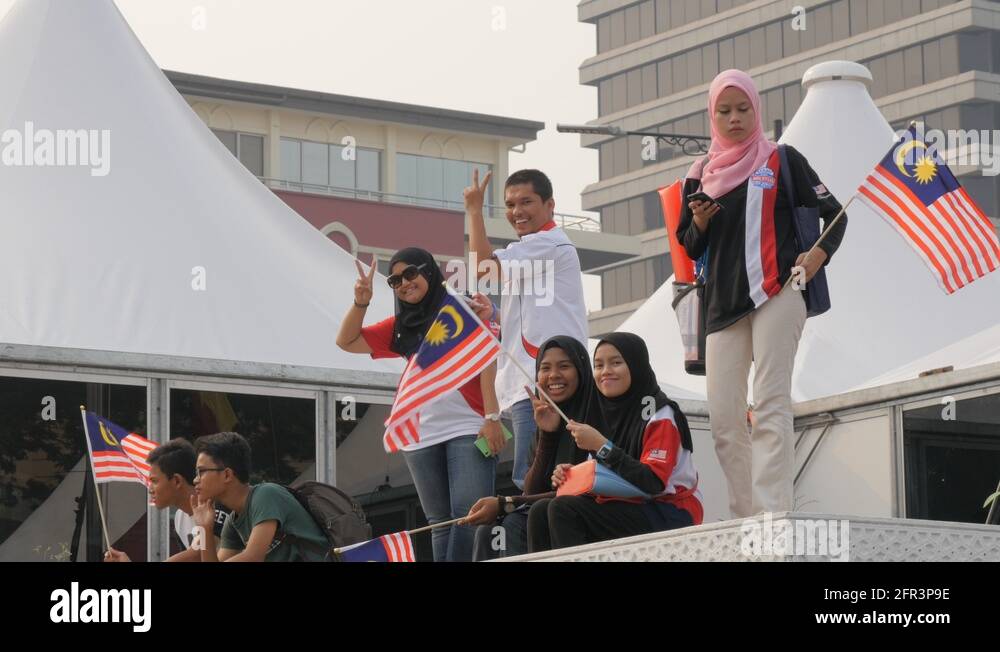 Muslim at independence day smile and wave flag,Kuala Lumpur,Malaysia ...