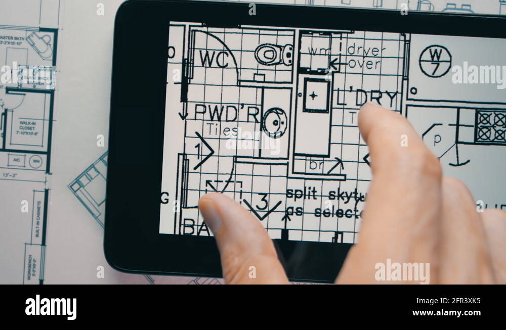 Architect moves his finger on the touchpad of the structure of the ...