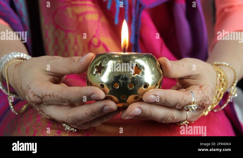 Deepak candle in the hands of Indian women Stock Video Footage - Alamy