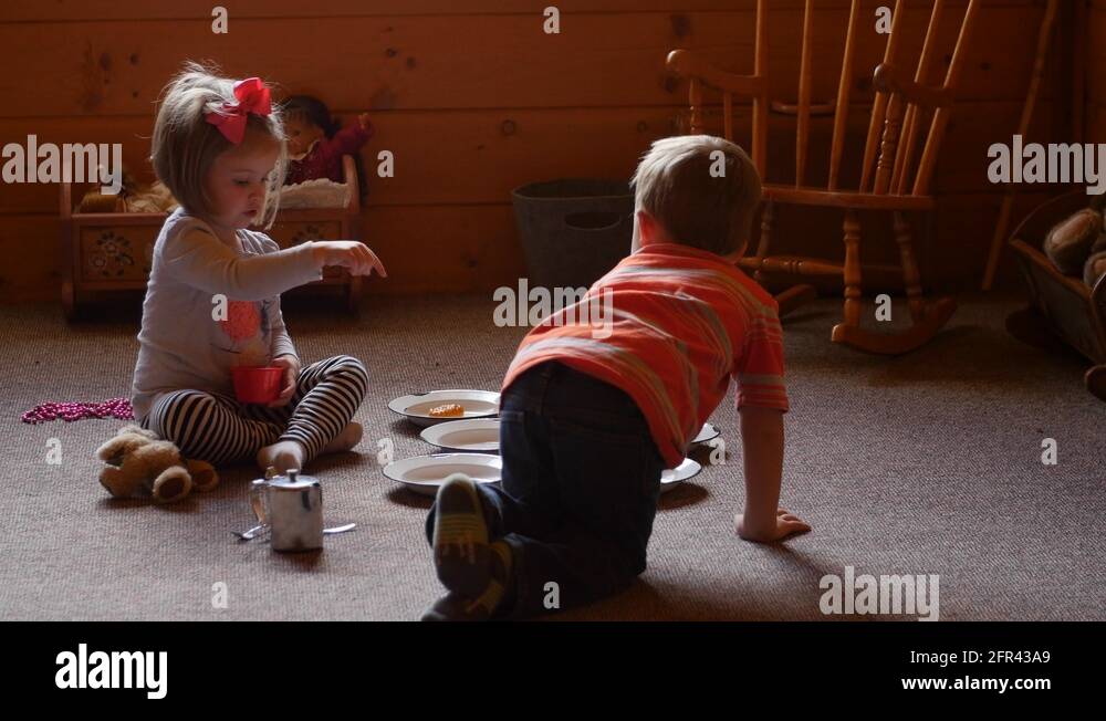 Two little kids playing house together at home Stock Video Footage - Alamy