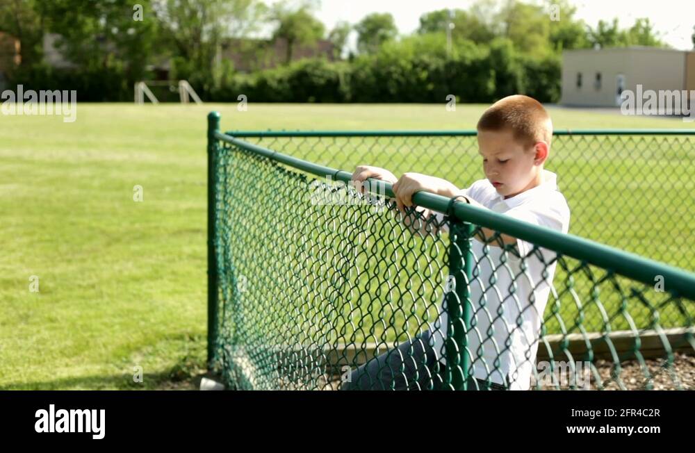 Boy climbing over fence Stock Videos & Footage - HD and 4K Video Clips ...
