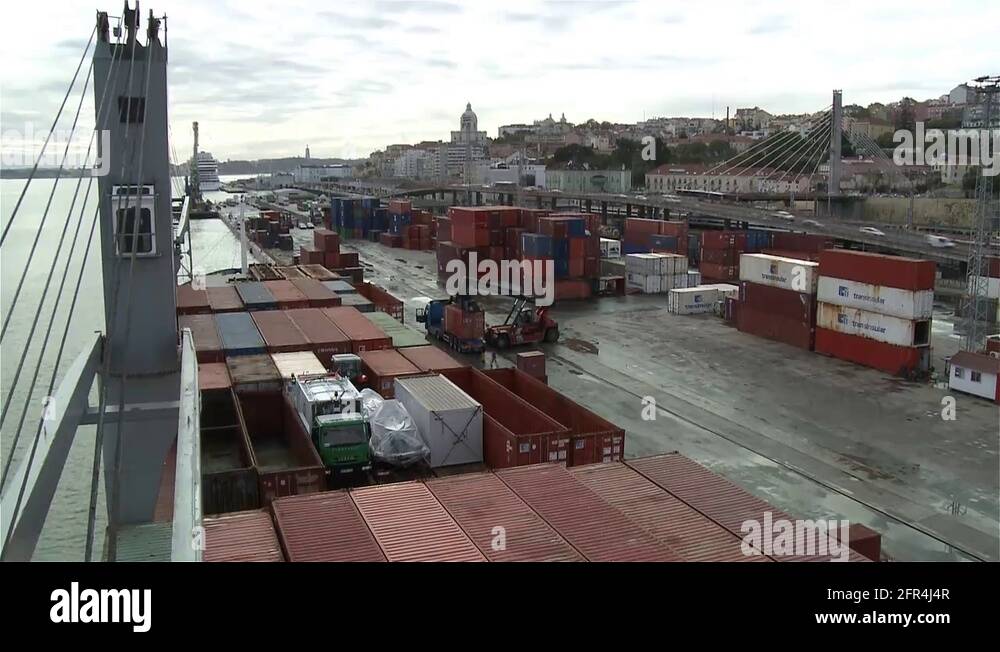 Heavy duty container handler moving shipping containers in harbor Stock ...