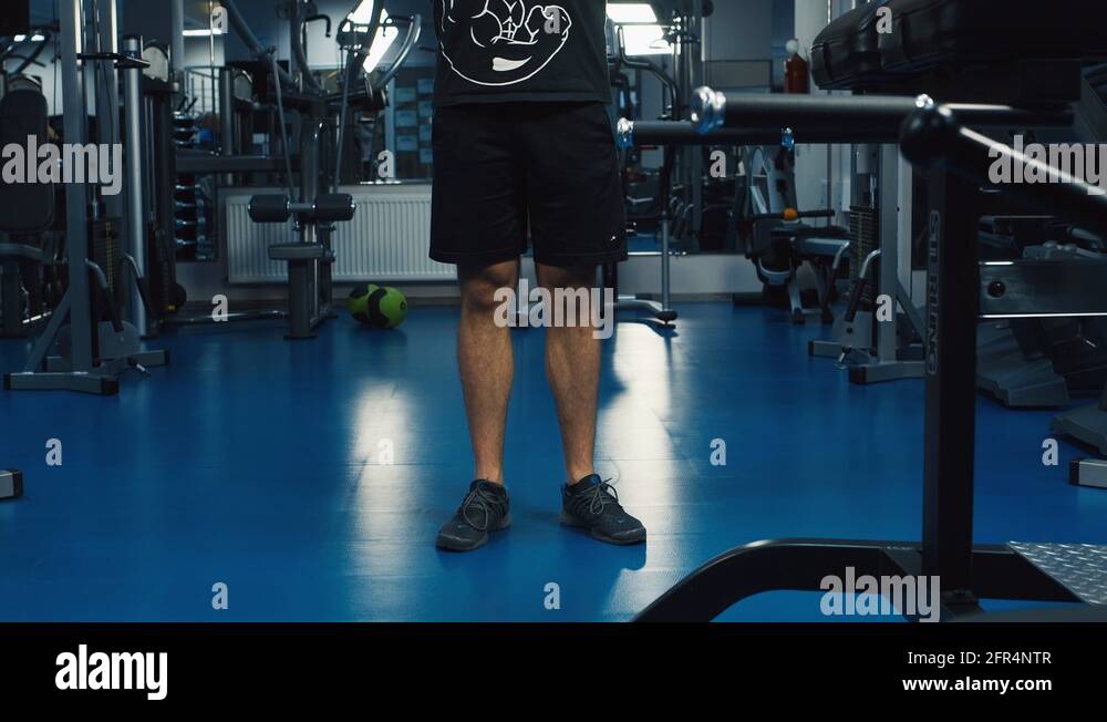 The man trains the biceps muscle on the block device Stock Video ...