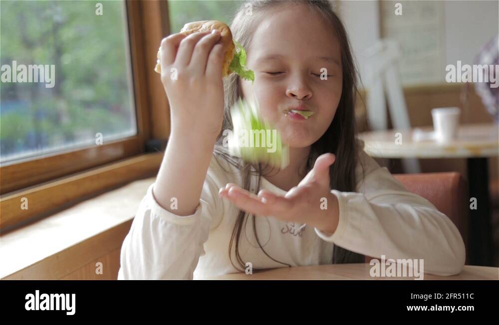 Girl eating messily Stock Videos & Footage - HD and 4K Video Clips - Alamy