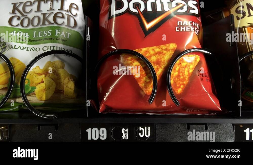 Nacho Cheese Doritos purchased from vending machine Stock Video Footage ...