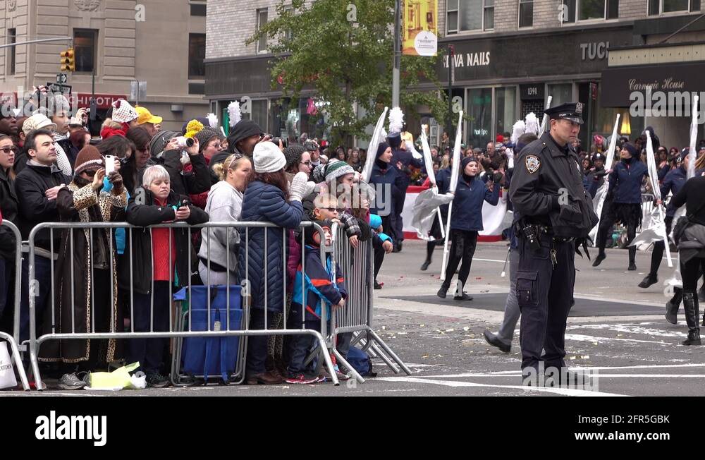Police with crowd of people behind fence at Macys Parade 4k Stock Video ...