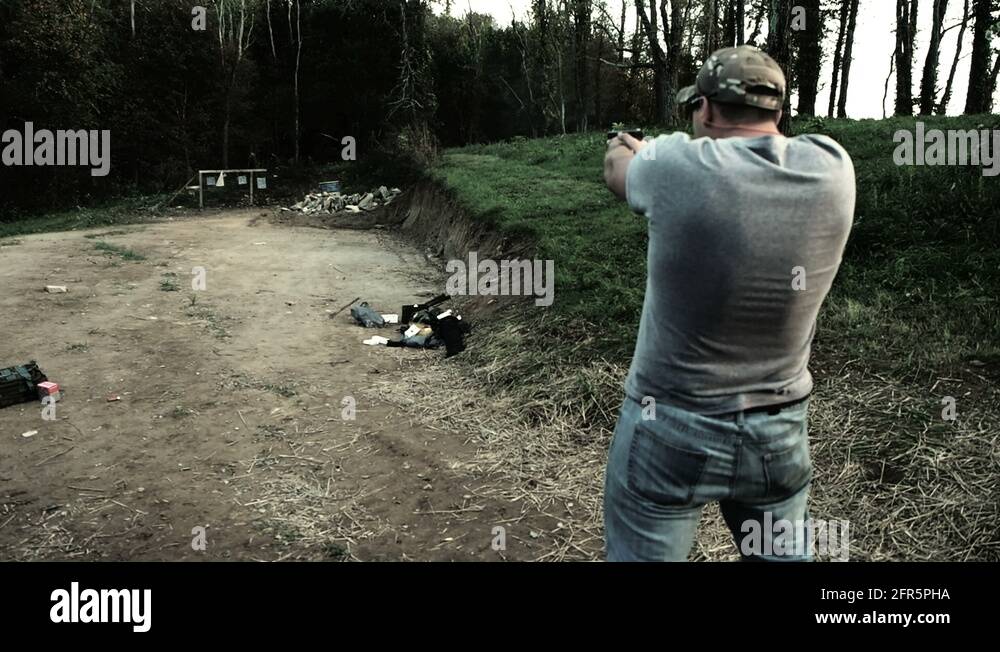 Man firing pistol Stock Videos & Footage - HD and 4K Video Clips - Alamy