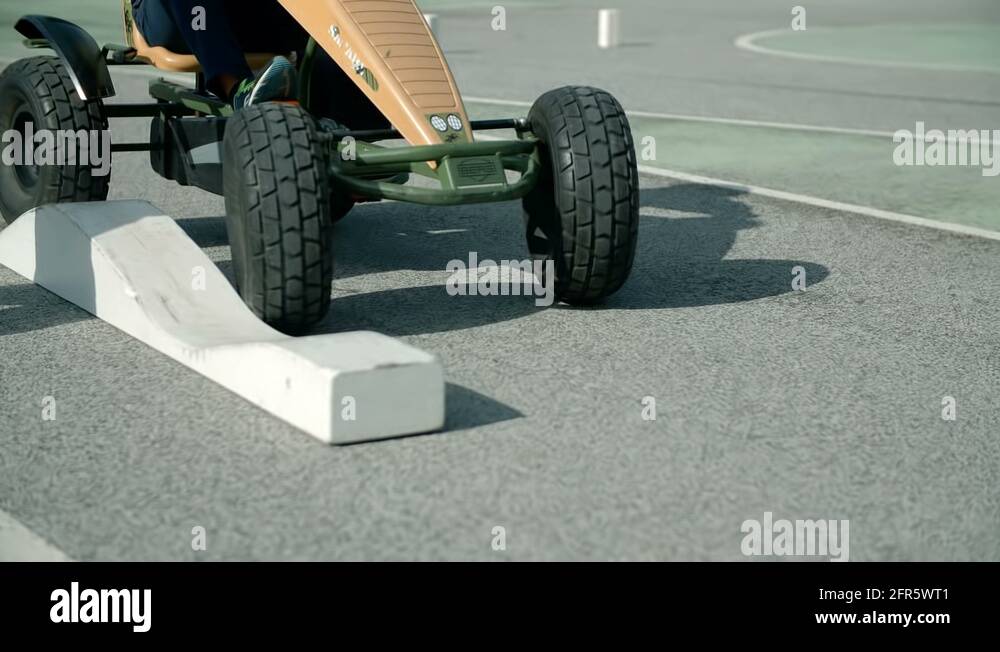 Overcoming bumps on a track Stock Video Footage - Alamy