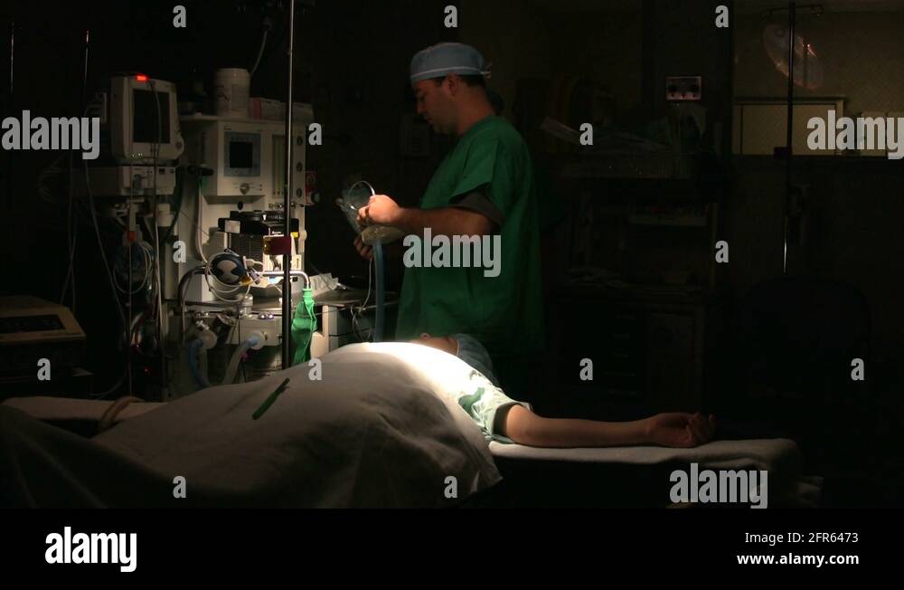 Surgery Staff Working In Operating Room Stock Video Footage - Alamy