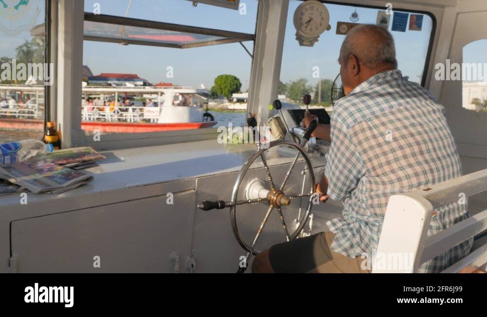 Ferry driver across Chao Praya river,Bangkok,Thailand Stock Video ...