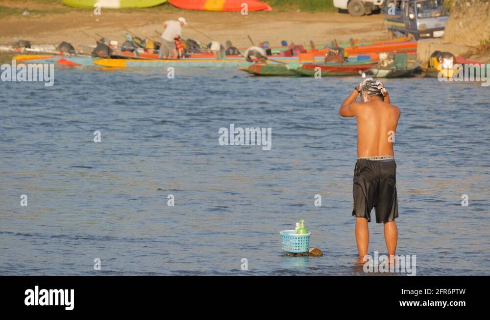 Man washing hair in river,Vang Vieng,Laos Stock Video Footage - Alamy
