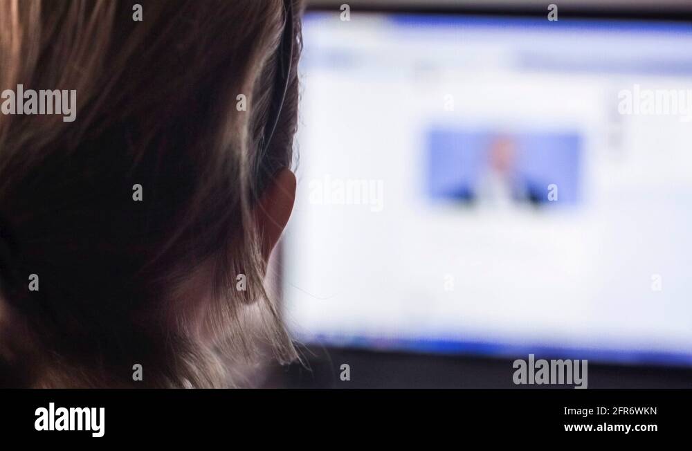 Back of girls head in front of computer monitor Stock Video Footage - Alamy