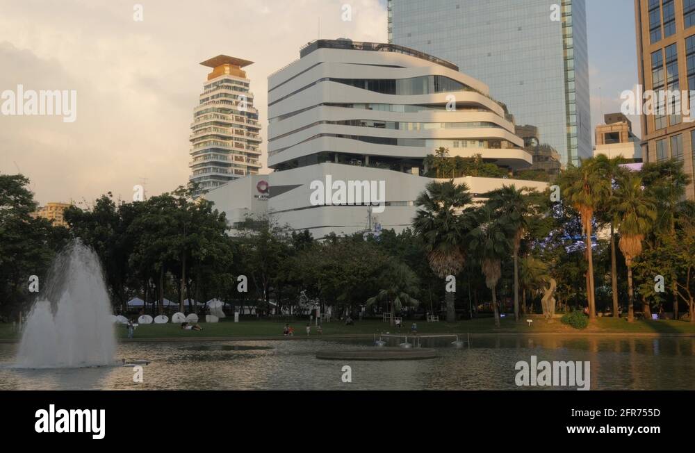 Benjasiri Park with lake and fountain at EMquartier ,Bangkok,Thailand ...