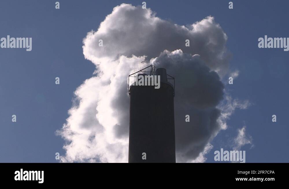 Smoke stacks from industry belching carbon and gases into the ...